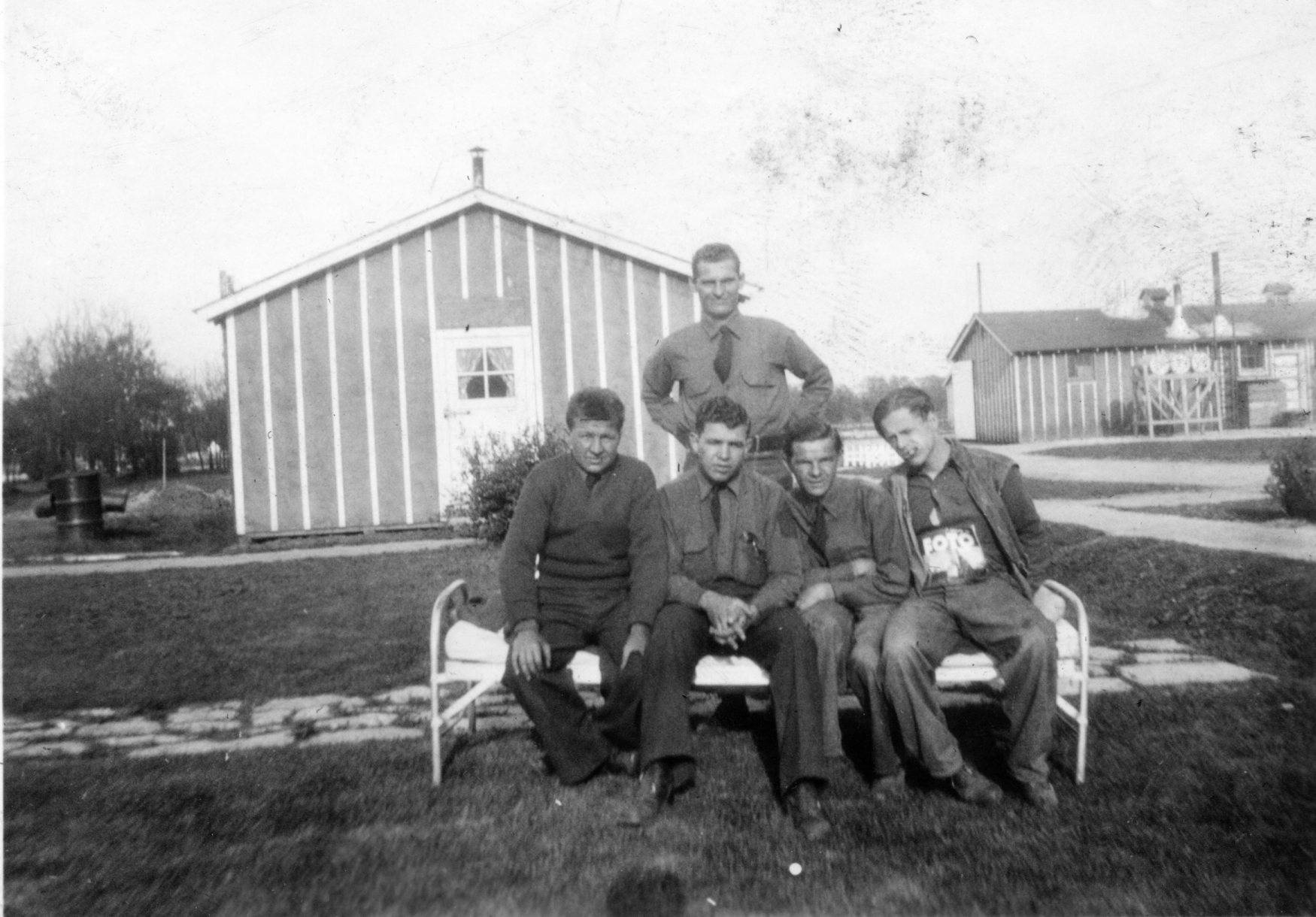 Men on Cot outside